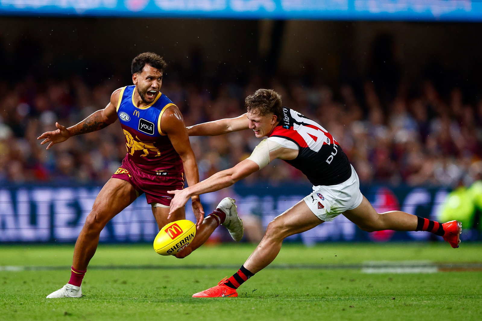 Brisbane holds off Essendon comeback to win by 18 as young Bombers gun ...